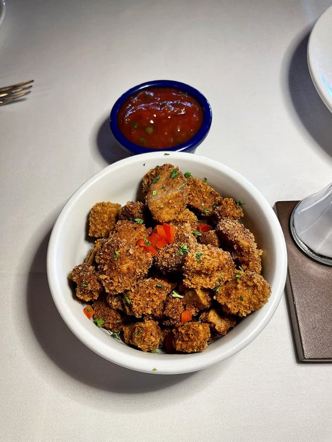 Golden-brown morsels of frontier bravery served with a side of cocktail sauce. Your taste buds are about to have a more adventurous day than you are.