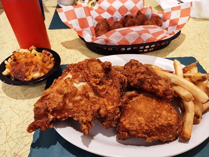 The holy trinity of comfort food: perfectly fried chicken, crispy fries, and a side that's probably not on your cardiologist's recommendation list.