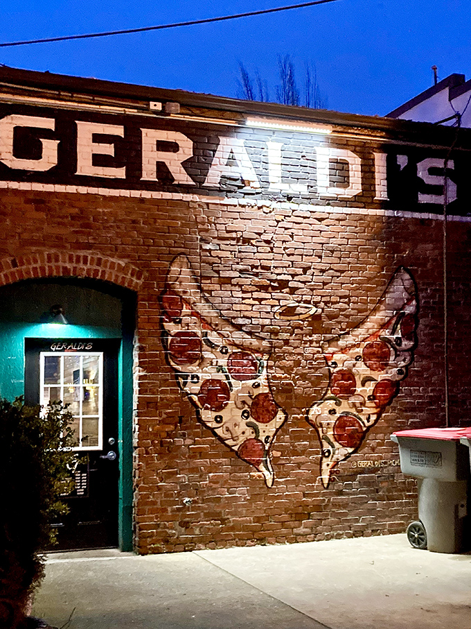 Geraldi's brick wall pizza mural is basically a love letter to carbs. This is the kind of street art that makes your stomach growl. 