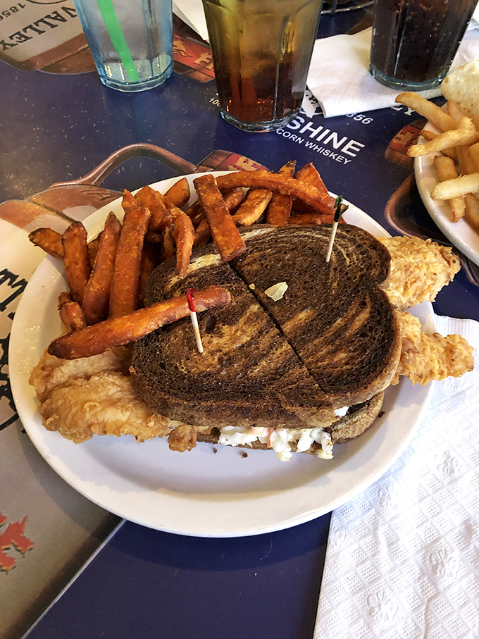 This isn't just a sandwich&mdash;it's architecture. Layers of perfectly grilled fish, melty cheese, and toasty rye create the Sistine Chapel of lunch options. 