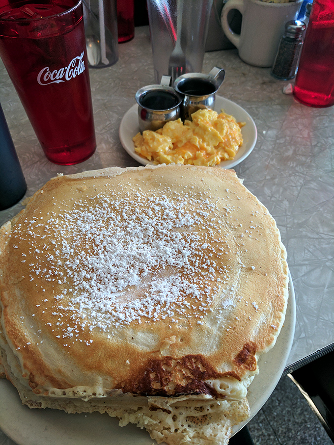 This pancake isn't just big&mdash;it's the kind of pancake that makes other pancakes feel inadequate. The powdered sugar snowfall is just showing off.