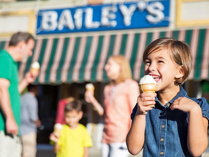 The universal language of childhood joy: that look when the first lick of Bailey's ice cream hits and suddenly everything is right in the world.
