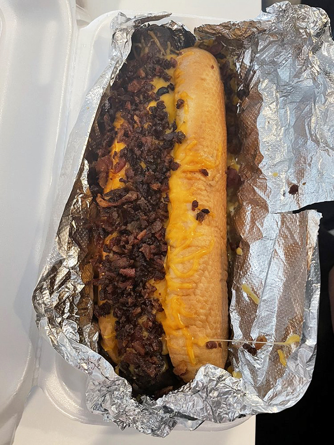 This beast of a chili cheese dog doesn't just satisfy hunger &ndash; it obliterates it. Melted cheese and hearty chili create the Cadillac of comfort food.