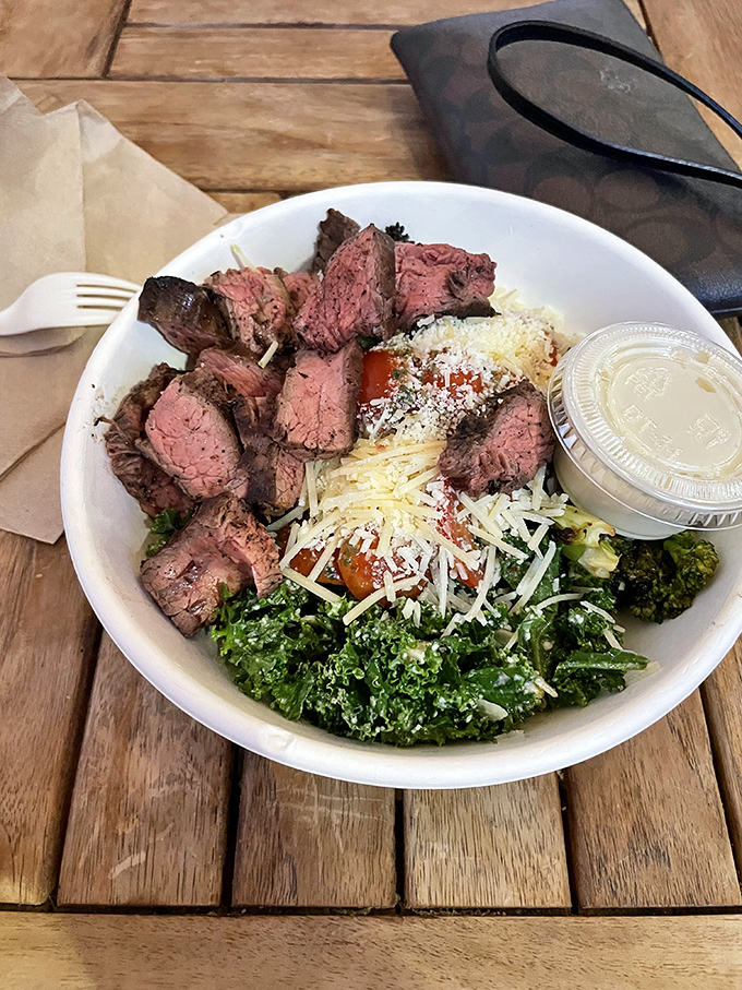 Perfectly seared steak atop a bed of vibrant greens&mdash;proof that salads can be both virtuous and indulgent, like a yoga instructor who loves cake.