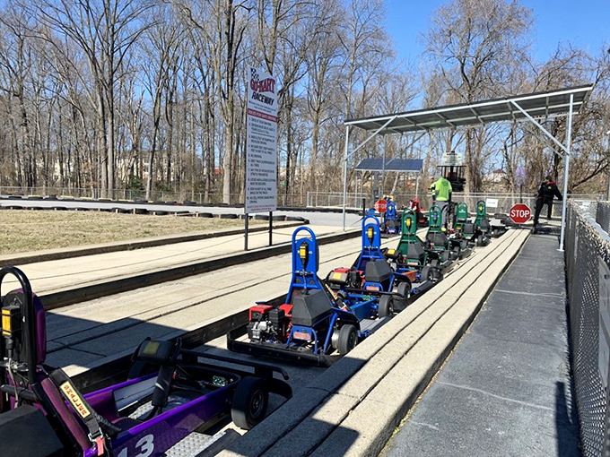 The pit stop lineup&mdash;where karts rest between adventures and mechanics perform their quiet magic to keep the wheels turning.