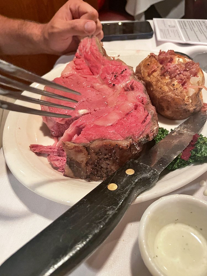 The king-size prime rib doesn't just feed you&mdash;it makes a statement about your place in the food chain. Baked potato as willing sidekick.