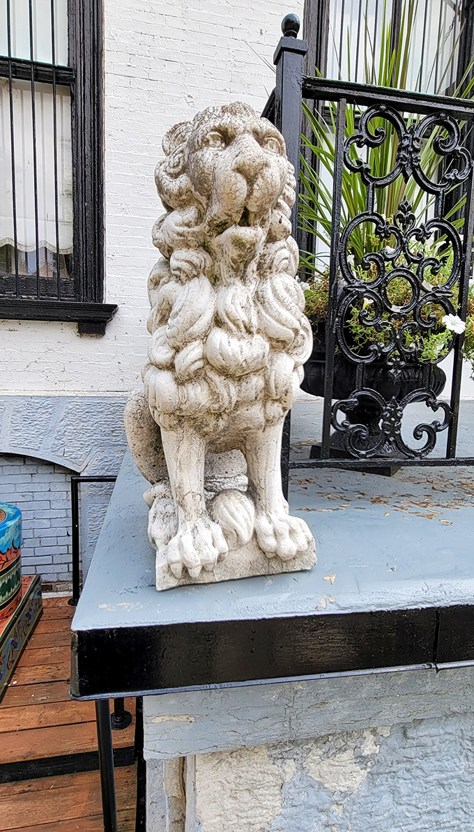 This weathered stone lion stands sentinel at the mansion's entrance. He's seen generations come and go, and probably has more stories than the tour guides.