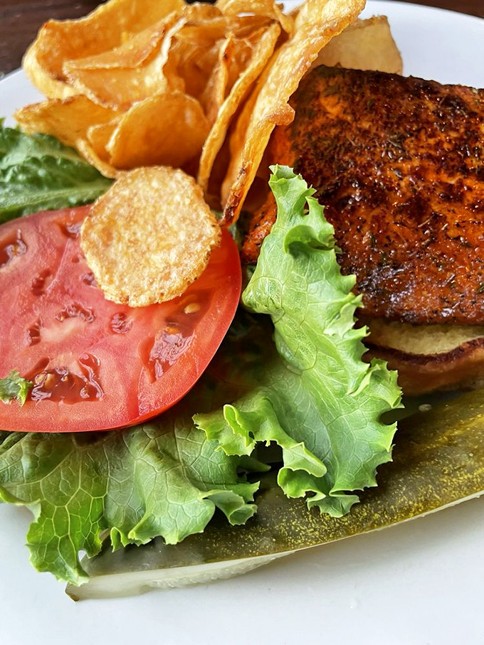 The blackened fish sandwich arrives with attitude and flavor that would make Old Bay himself stand up and applaud. 