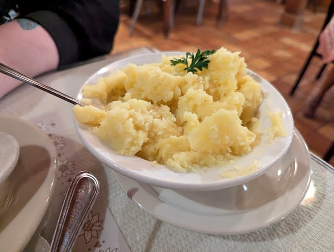 Behold the star of our story: mashed potatoes so perfectly executed they deserve their own fan club. Buttery, cloud-like perfection garnished simply with parsley.
