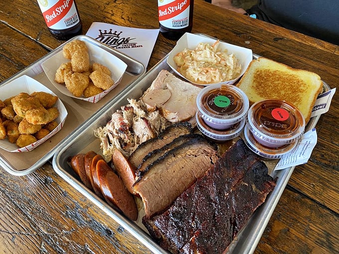 The barbecue sampler that makes decision-making obsolete. Why choose between brisket, sausage, and pulled pork when you can have the holy trinity?