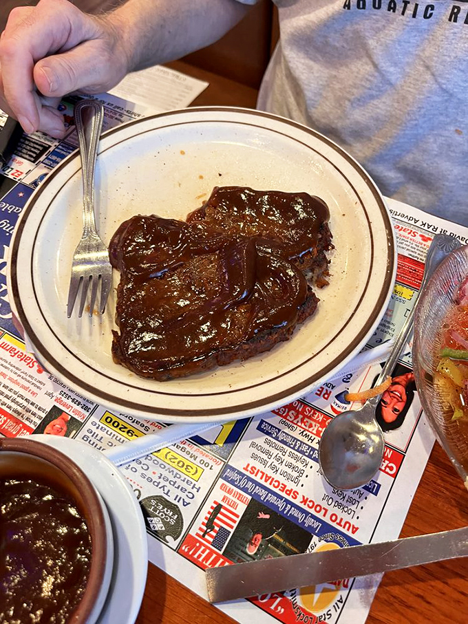 Meatloaf smothered in gravy so rich it should have its own tax bracket. Comfort food that makes Monday meetings seem bearable.