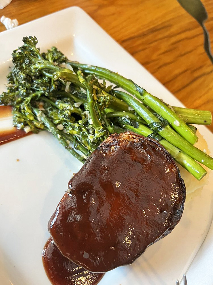 The meatloaf's BBQ glaze creates a symphony with the bright broccolini. Like finding the perfect backup singers for Elvis&mdash;everything just works.