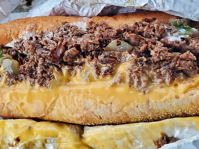 Witness the molten cheese embrace thinly sliced ribeye in a dance as old as Philadelphia itself &ndash; this is sandwich architecture at its finest.