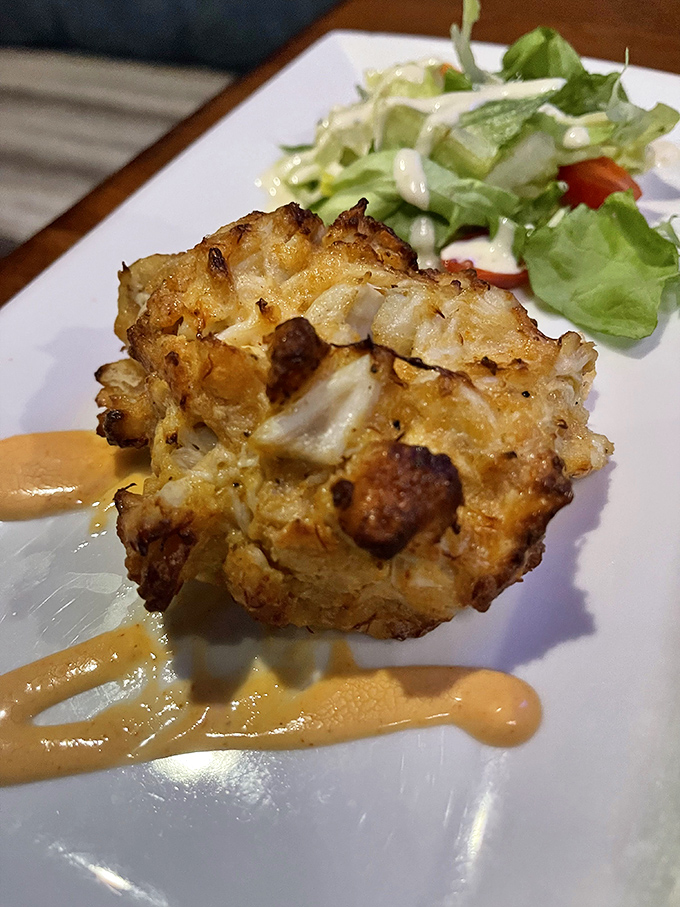 The holy grail of crab cakes: minimal filler, maximum crab, and a crust that shatters like your willpower when the dessert menu arrives.