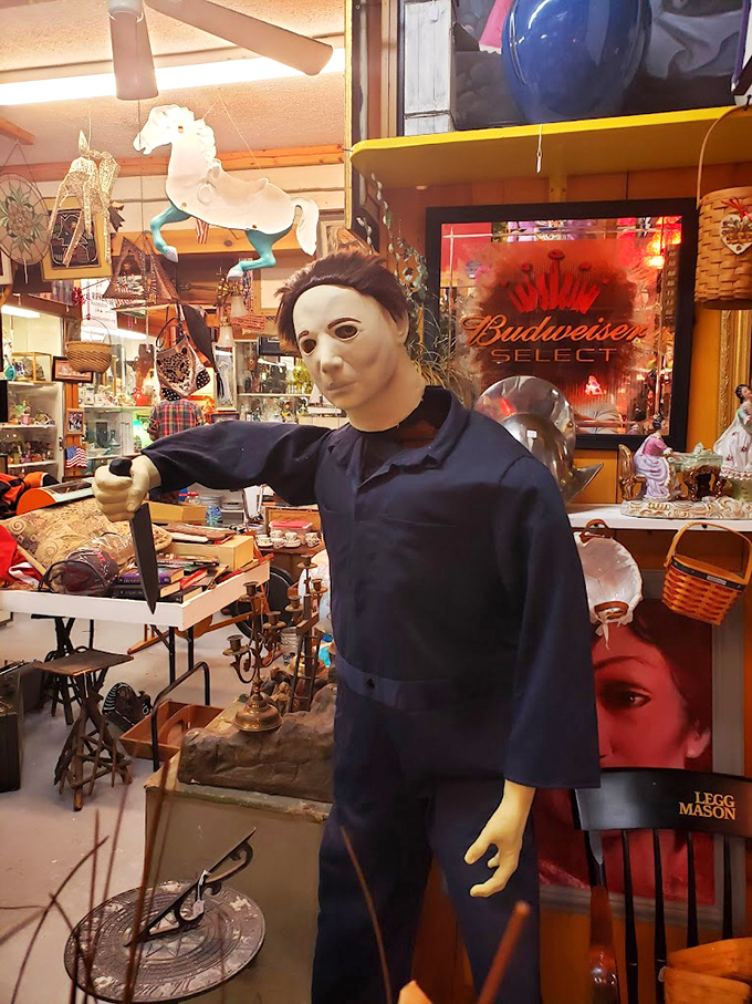 Michael Myers stands guard among vintage collectibles. Nothing says "unique shopping experience" quite like browsing with horror film icons.