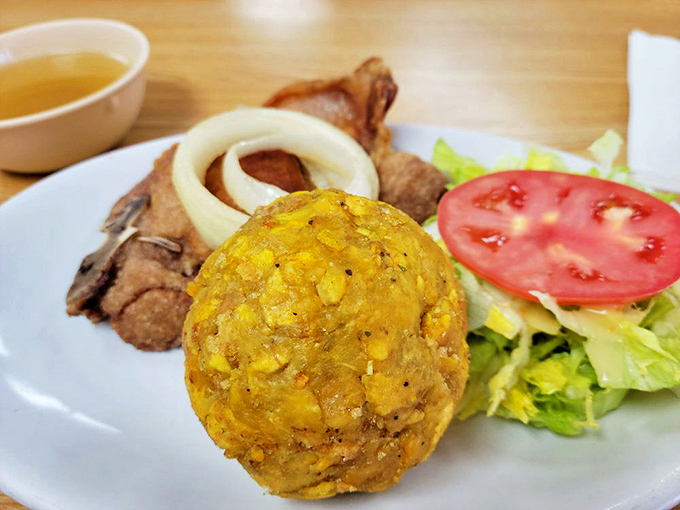Plantains standing guard around a pool of savory goodness. This dish doesn't need a passport to transport you straight to Central America. 