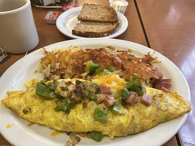 This Denver omelet and its crispy hash brown sidekick are the breakfast buddy comedy we all need. Perfectly executed classics.