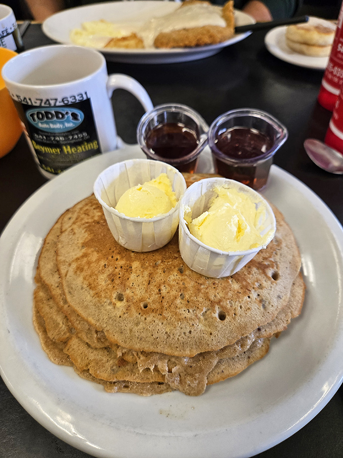 Pancakes so perfectly golden they make you wonder if the griddle has been seasoned with decades of breakfast magic. 