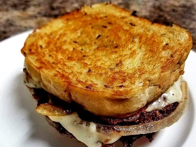 This isn't just a patty melt—it's a gooey, caramelized monument to the sacred union of beef, cheese, and butter.