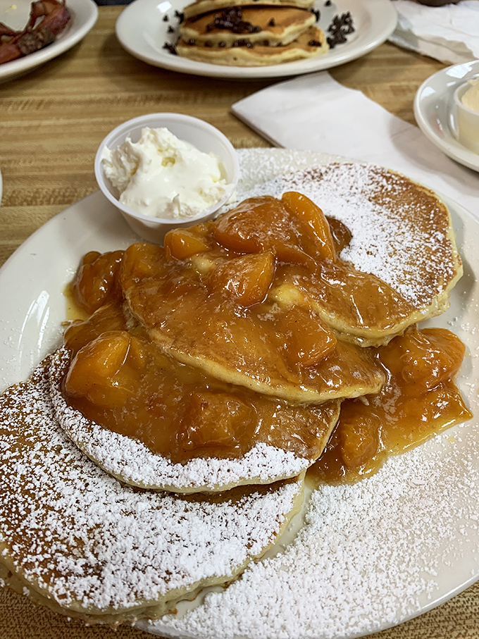 Peach-topped pancakes dusted with powdered sugar&mdash;Georgia's breakfast version of a crown jewel. The side of whipped cream is basically mandatory.