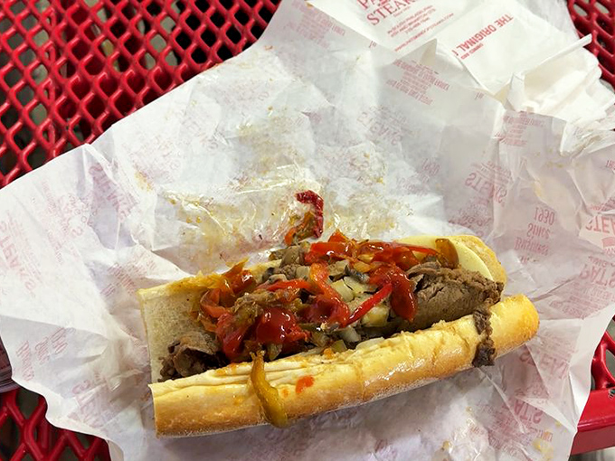 Hot peppers add a fiery kick to this beauty. It's like the classic cheesesteak went on vacation to a spicier part of town and came back transformed.