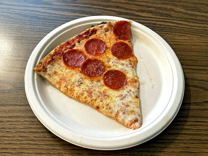 Sometimes simplicity wins the day. This pepperoni pizza slice has the perfect cheese-to-sauce ratio and that distinctive thin, crispy crust that shatters just right.