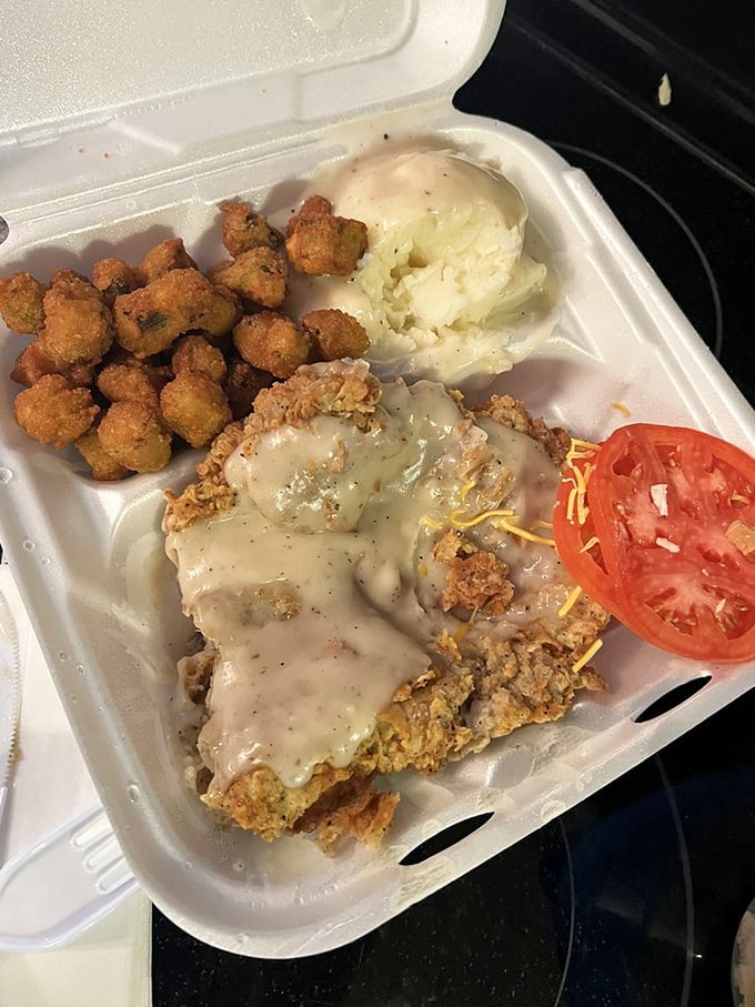 Golden fried okra alongside a chicken fried steak dinner&mdash;this isn't just a meal, it's Oklahoma on a plate.