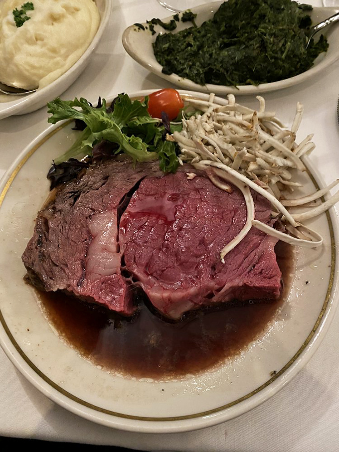 Medium-rare perfection swimming in its natural jus, accompanied by creamed spinach and mashed potatoes. This is what dinner dreams are made of.