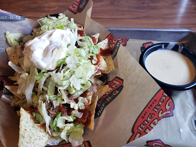 Barbecue nachos: where Tex-Mex meets Alabama smoke. That pulled pork perched atop crispy chips creates a flavor explosion that should require a permit.
