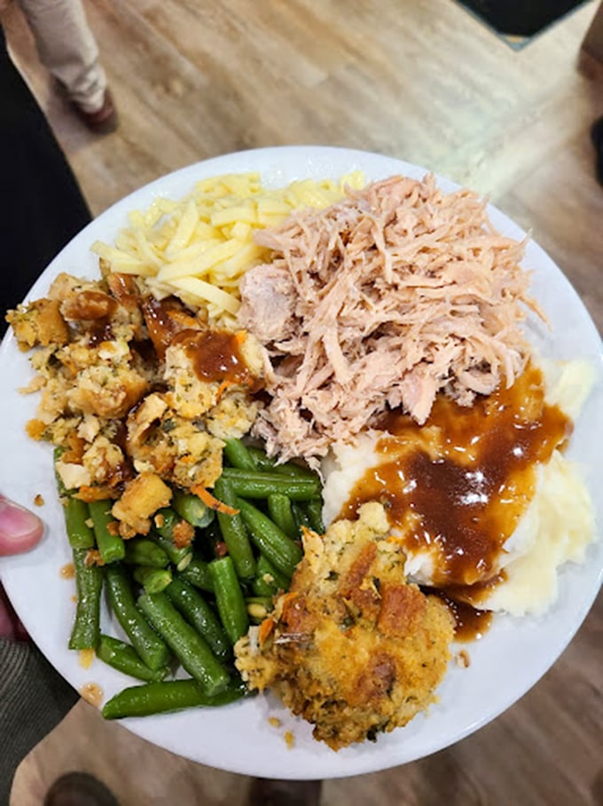 A plate that tells the whole story&mdash;tender pulled pork, homemade stuffing, and green beans that haven't forgotten what vegetables should taste like.