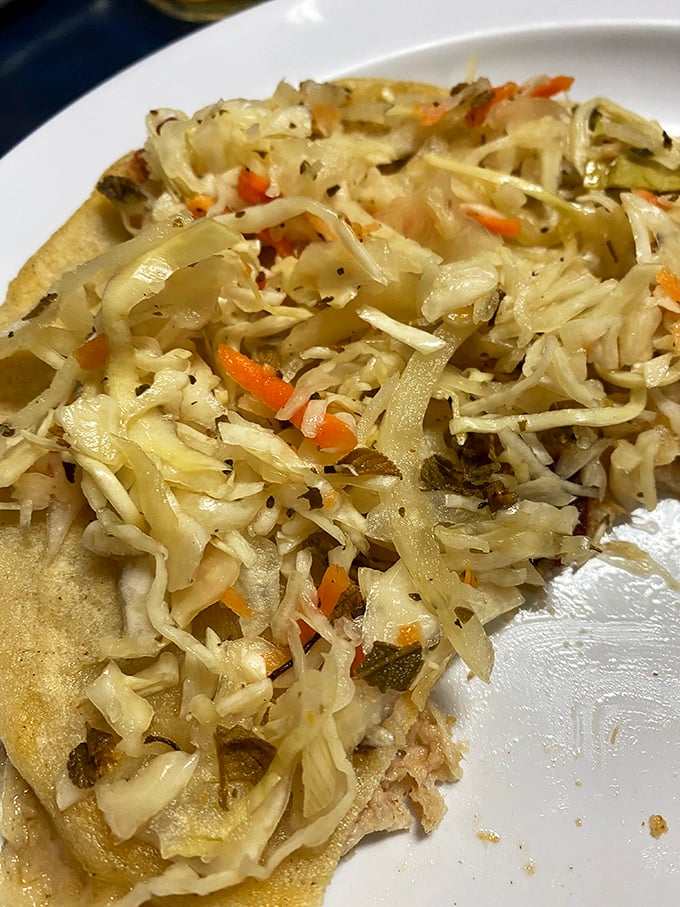 Pupusas with the perfect crisp-to-tender ratio, topped with tangy cabbage slaw. It's the kind of simple perfection that makes you wonder why you'd eat anything else.