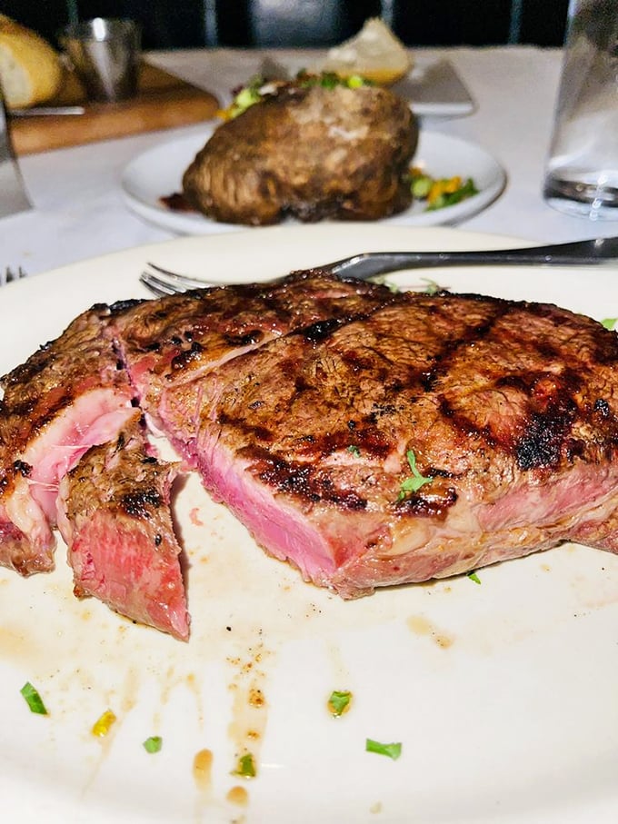 The perfect medium-rare ribeye, sliced to reveal that glorious pink center. This is what beef dreams about becoming when it grows up.