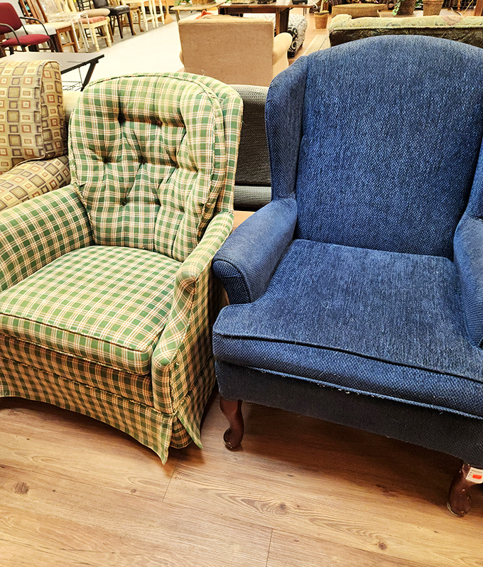 Like an odd couple sitcom, these two armchairs—one plaid, one blue—wait for someone to give them a new living room to disagree in.