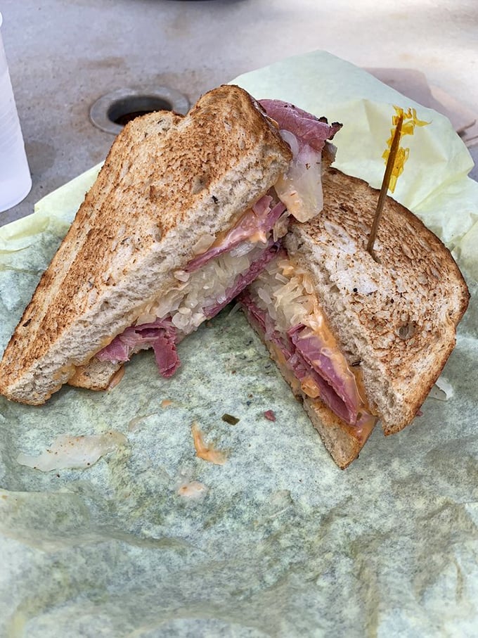 The cross-section reveals the truth: perfect meat-to-sauerkraut ratio and cheese melted into every crevice. This Reuben doesn't need a filter.