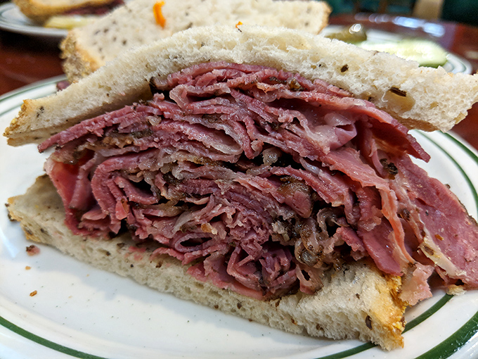 Behold the architectural marvel that is Honey's Reuben&mdash;where corned beef is stacked with the precision of a Jenga master who really means business.