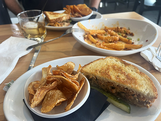 The Reuben and chips, a power couple more iconic than Bogart and Bacall. That melty cheese is making a break for freedom.