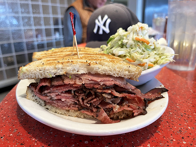 The Reuben in its natural habitat&mdash;surrounded by creamy coleslaw and waiting to be devoured by someone wearing a Yankees cap in Titans territory.