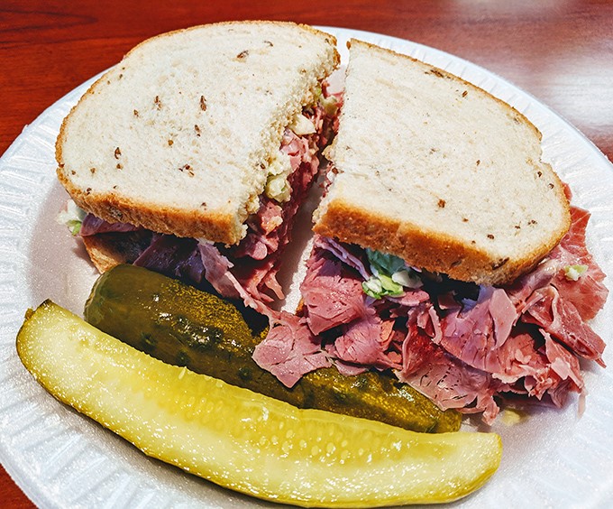 Corned beef stacked higher than your weekend expectations. The pickle isn't a garnish&mdash;it's a palate-cleansing necessity between magnificent bites.