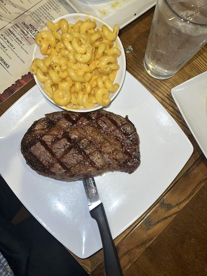 A perfectly seared rib eye plays wingman to mac and cheese that's unapologetically rich&mdash;comfort food that's earned its stripes.