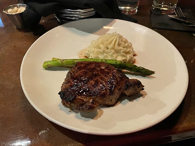 Simplicity at its most sublime&mdash;a perfectly cooked steak with asparagus and mashed potatoes. No distractions, just pure, unapologetic flavor that commands your full attention.