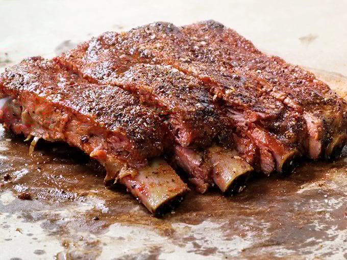 These ribs aren't just falling off the bone &ndash; they're practically volunteering to jump onto your plate with a smoky enthusiasm that's contagious.