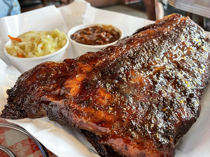 These ribs don't just fall off the bone &ndash; they perform a perfectly choreographed dance with your taste buds while that smoke ring whispers sweet nothings.