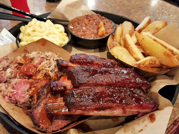 The holy trinity of BBQ: ribs with bark so perfect it should be in a museum, brisket that glistens with promise, and pulled pork that makes you question all your life choices.