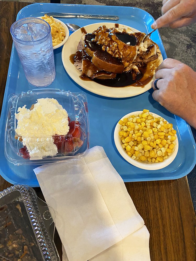 This isn't just roast beef&mdash;it's a tender, gravy-bathed masterpiece sharing its blue tray with mac and cheese that could make a grown adult weep.