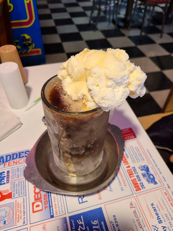 A proper root beer float doesn't skimp on the ice cream. This magnificent mountain of vanilla could make a grown adult giggle with anticipation.
