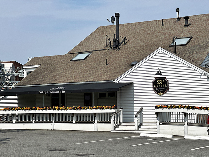 S&P Oyster Restaurant's flower-lined porch offers the perfect perch for people-watching while savoring the ocean's bounty in classic New England style.