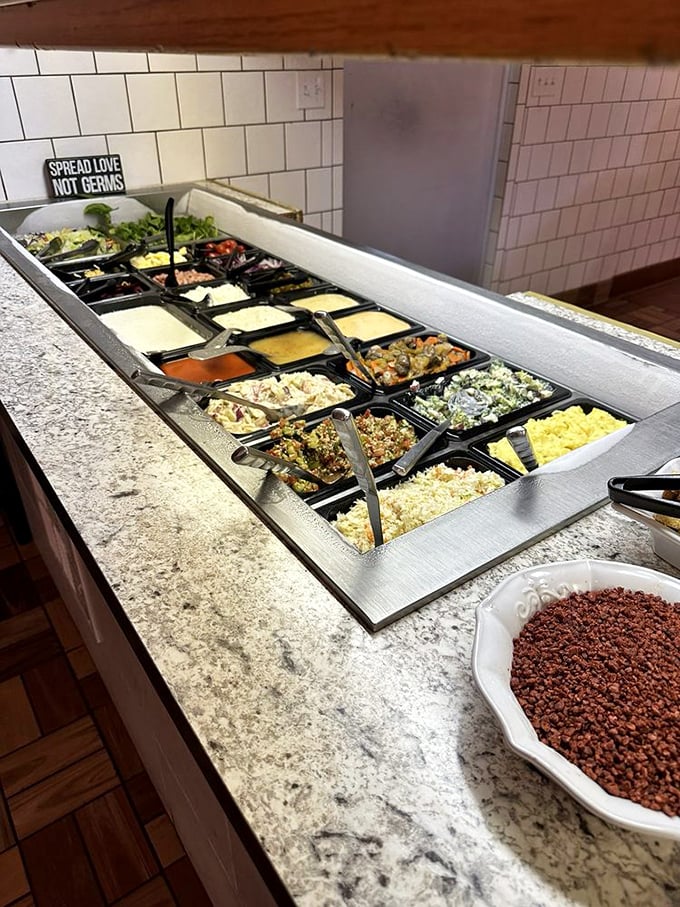 "Spread love not germs" says the sign, but what it really means is "please leave some salad toppings for the rest of us."