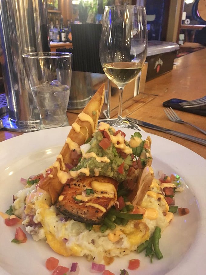 This isn't just food architecture&mdash;it's a flavor skyscraper. Mashed potatoes form the foundation, while perfectly seared protein and fresh guacamole reach for the culinary heavens.