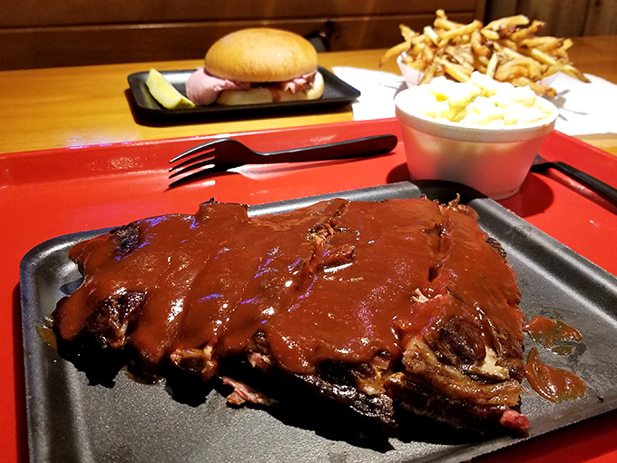 These sauce-slathered ribs aren't just food; they're edible artwork where each brushstroke of sauce adds another layer of flavor.