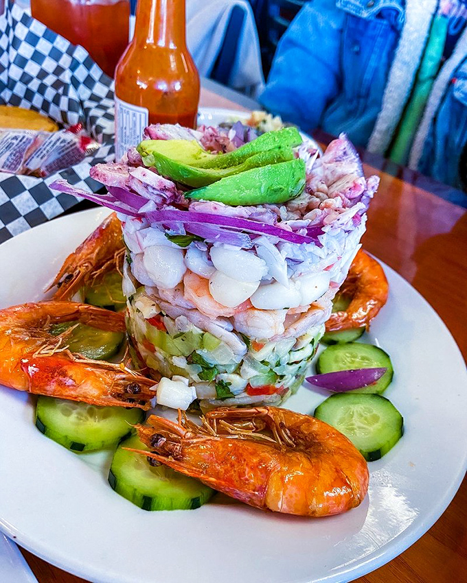Architectural genius meets culinary artistry in this seafood tower. Layers of oceanic treasures stacked with the precision of a Jenga master with steady hands.